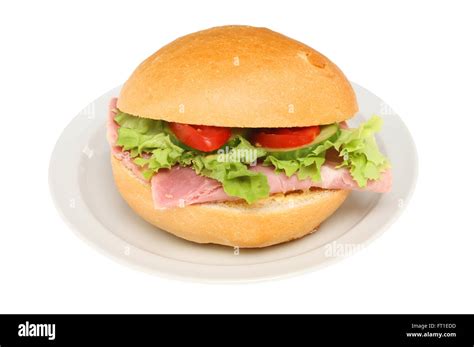 Crusty Bread Ham Salad Roll On A Plate Isolated Against White Stock