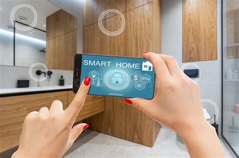 Smart Home Automation App On Smartphone Hold By Female Hand With Home Interior In Background