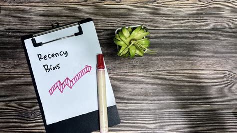 Concept Of Recency Bias Write On Paperwork Isolated On Wooden Table Stock Image Image Of