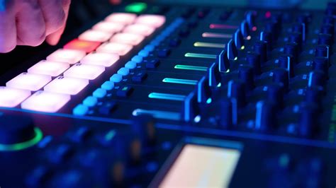 Professional Dj Plays A Beat Sampler With Color Drum Pads And Samples