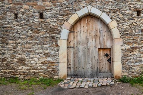 Ancient Wooden Door In Old Stone Castle Wall Stock Image Image Of
