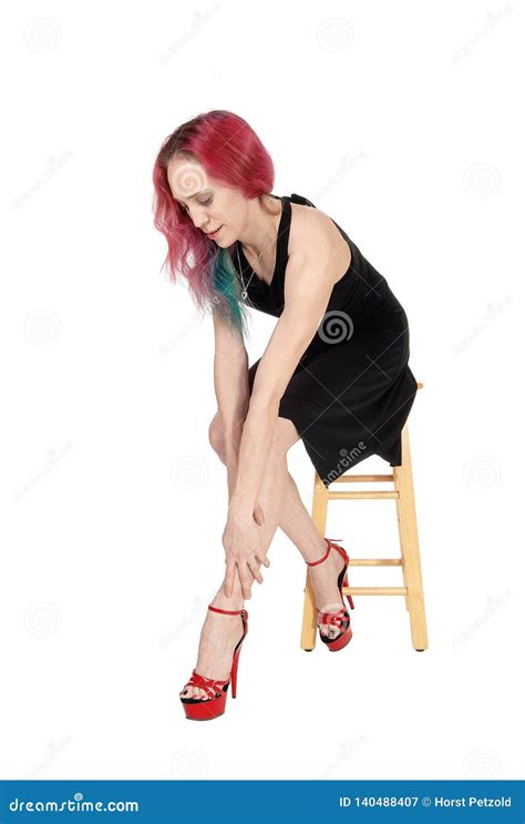Woman Sitting And Fixing Her Heels Stock Image Image Of Footwear Female 140488407