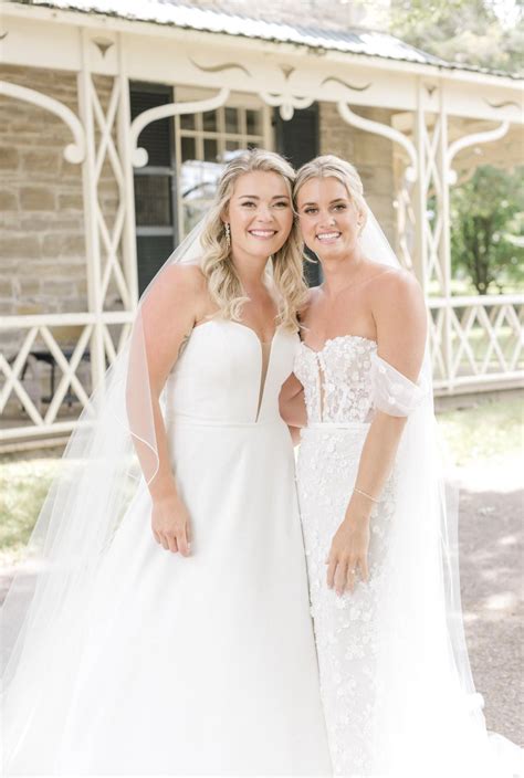 Two Brides Special Day Under A Lush Display Of Babys Breath Roses