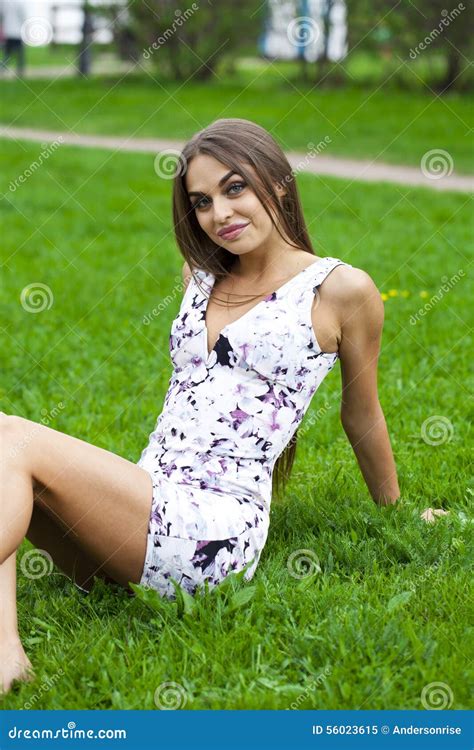 Young Pretty Girl Sitting On Green Grass Stock Image Image Of Elegant Hippie 56023615