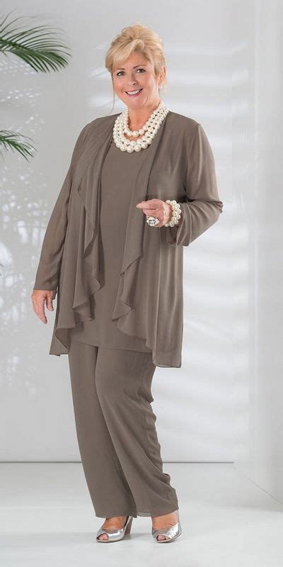 a woman in brown is posing for the camera