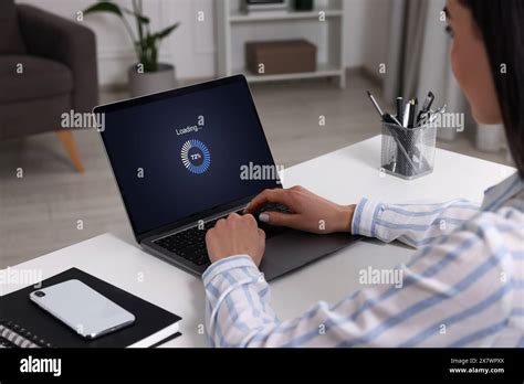 Loading Screen Displaying Progress Woman Working On Laptop At Table Indoors Closeup Stock