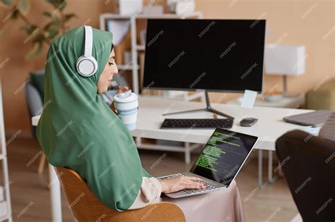 Premium Photo Muslim Woman As Female Programmer Writing Code