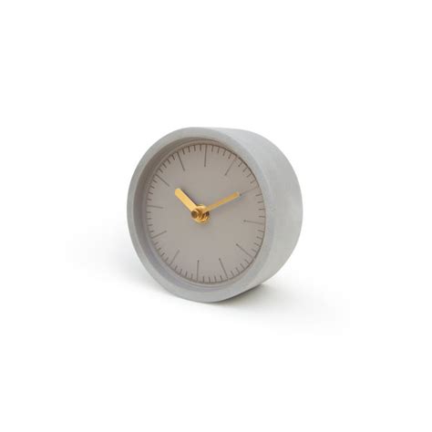 Concrete Clock A Concrete Clock With A Painted Face And Gold Hands