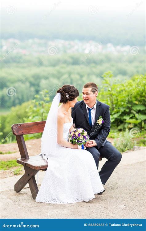 Attractive Bride And Groom Sitting On A Bench Stock Image Image Of Happiness Adult
