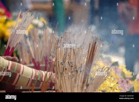 Bundle Of Burning Incense Sticks Commonly Offered At Temples And