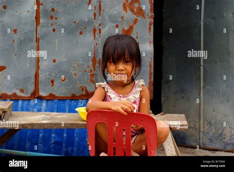A Young Girl Returns From School She Lives In A Shantytown Near The
