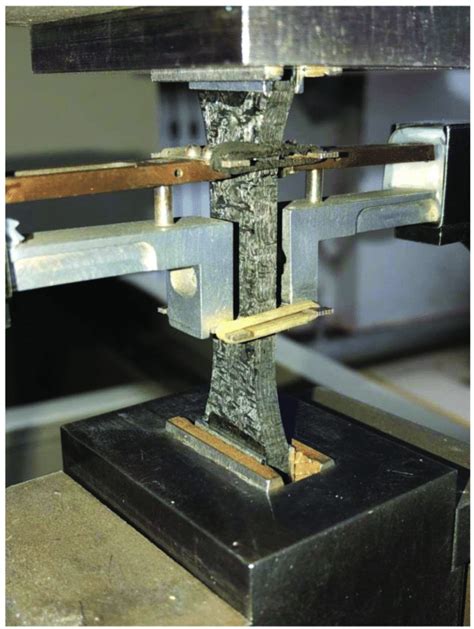 Photograph Of Tensile Specimen And Clip On Extensometer Download