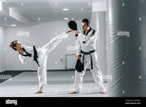 Caucasian Handicapped Highly Motivated Girl Practicing Taekwondo With