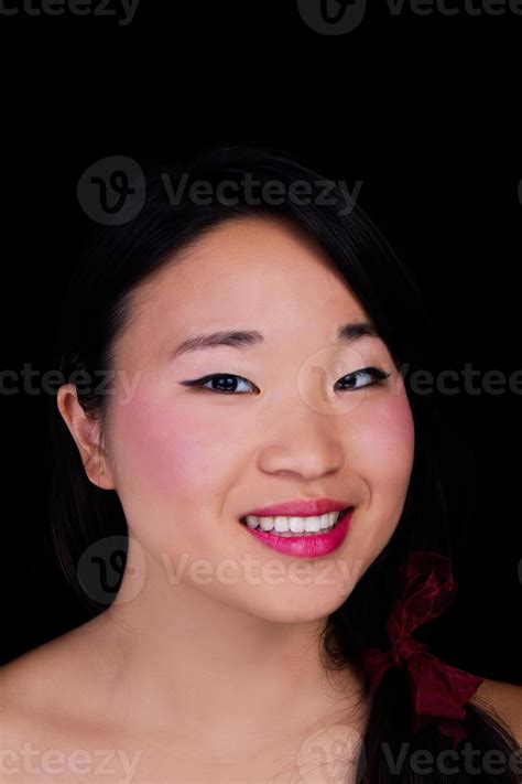 Portrait Japanese American Woman Smiling With Red Bow In Hair 42556020