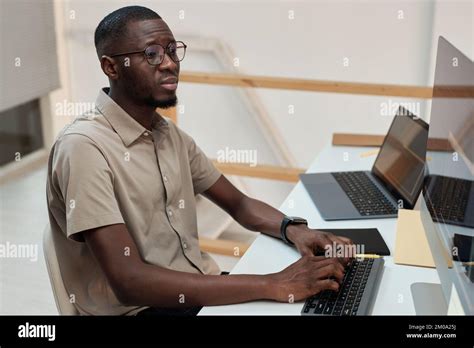 Serious Black Programmer Developing Software Updates Side View Stock