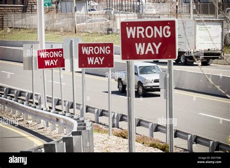 Multiple Traffic Signs Reading Wrong Way Near The Exit Of A Highway Stock Photo Alamy