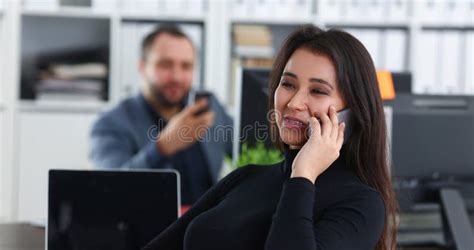 Young Pretty Brunette Woman In Office Work With Her Boss Hold