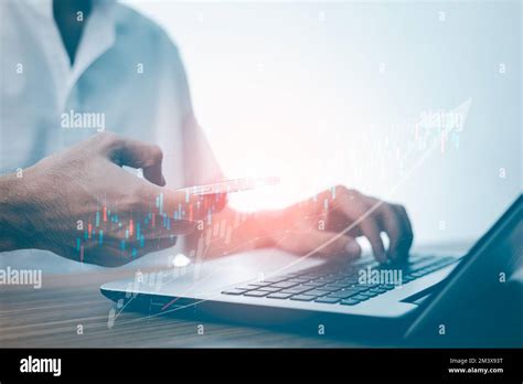 Male Trader Investor Analyst Holding Smartphone In Hand Analyzing Stock