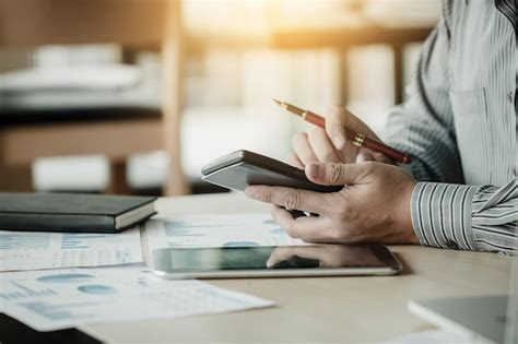 Premium Photo Businessman Calculation And Holding Calculator Analysis