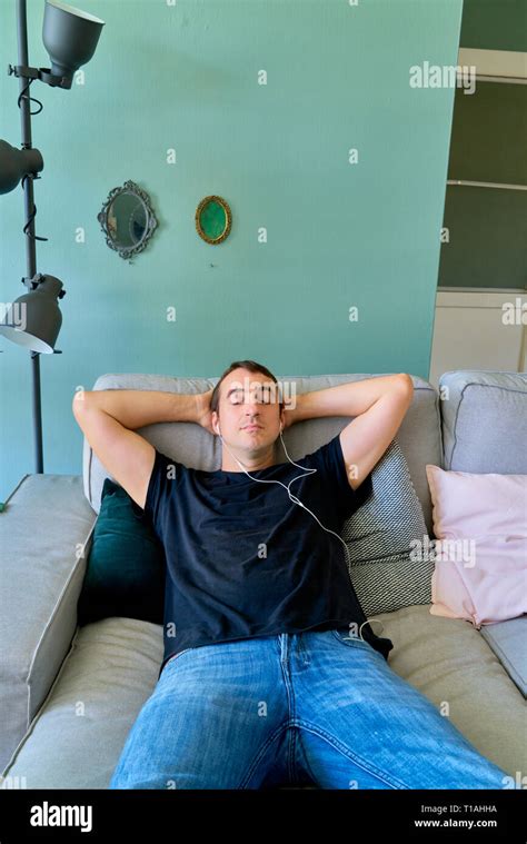 Handsome Guy Posing Lying Down Relaxing And Stretching Stock Photo Alamy