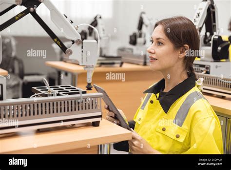 Engineer Women Learning Education In Industrial Robotics Program With