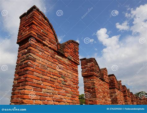 Ancient Battlements With Crenellations On The Wall Made With Old Bricks