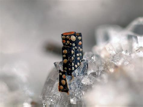 Pseudobrookite Crystals Covered With Cristobalite Spots With Enclosed Or Moistured Ilmenite