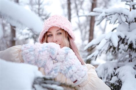 Premium Photo Winter Woman In Snow Looking At Camera Outside On