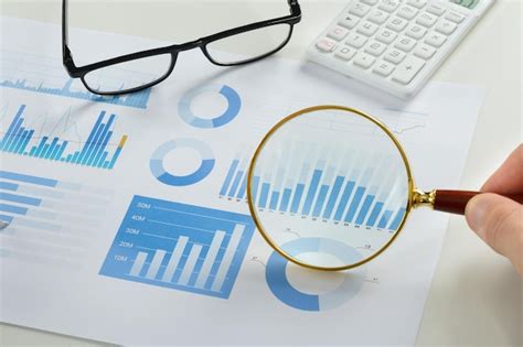 Premium Photo Person Holding Magnifying Glass Over Graph