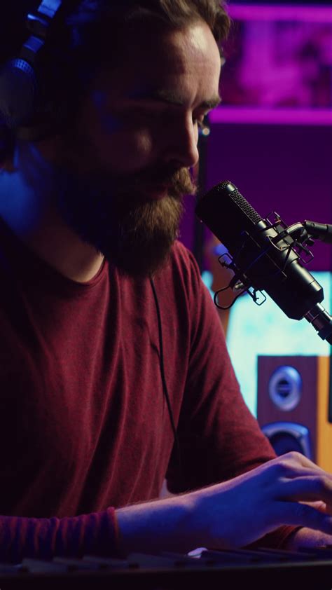 Vertical Video Songwriter Recording A New Song With Microphone And Midi Controller Playing