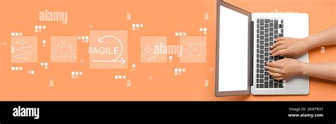 Female Hands With Modern Laptop On Orange Background Concept Of Agile Stock Photo Alamy