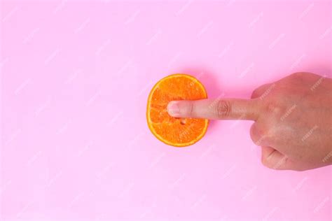 Premium Photo Sex Education With Oranges Isolated On Pink Background