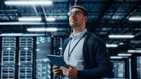 Successful Data Center It Specialist Using Tablet Computer Server Farm Cloud Computing Facility