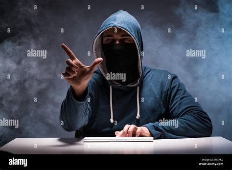 Computer Hacker Working In Dark Room Stock Photo Alamy