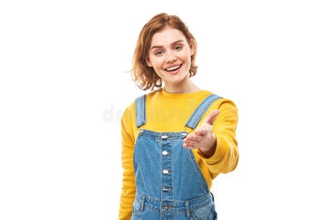 Portrait Of Friendly Redhead Girl Chooses You Points Finger At The