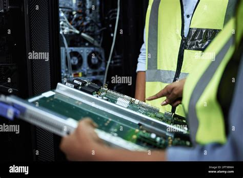 Taking A Look At The Hardware Two Unrecognizable Computer Programmers