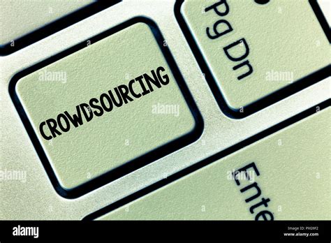 Conceptual Hand Writing Showing Crowdsourcing Business Photo