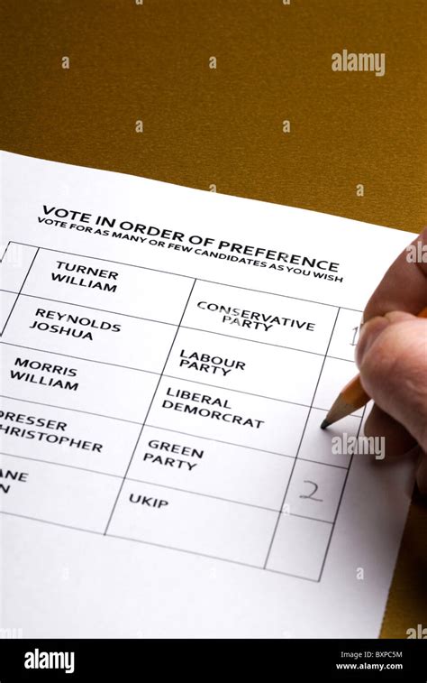 Male Hand Completing A Voting Form Hi Res Stock Photography And Images Alamy