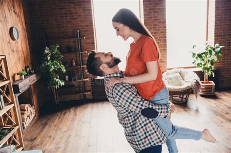 Photo Of Cheerful Cute Young Couple Cuddle Enjoy Weekend Have Fun