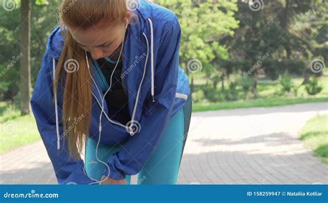 Cropped Shot Of A Female Athlete Rubbing Her Injured Knee After Running