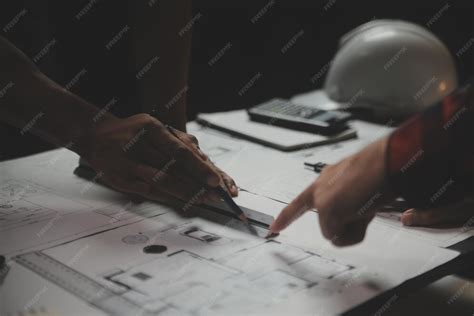 Premium Photo Engineer Teamwork Meeting Drawing Working On Blueprint