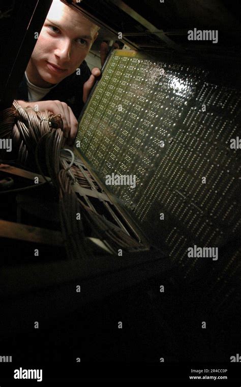 Us Navy Aviation Electronics Technician 3rd Class Inserts A Circuit Card Assembly Into A Testing