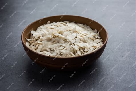 Premium Photo Raw Flattened Rice Or Thick Or Thin Rice Flakes For
