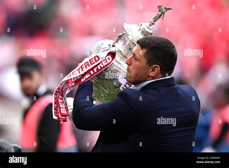 Wigan Warriors Head Coach Matt Peet Celebrates With The Trophy In Front