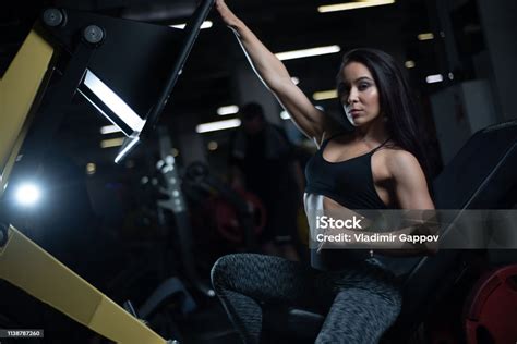 Fitness Girl Posing In The Gym Showing Off Her Body And Relaxing After
