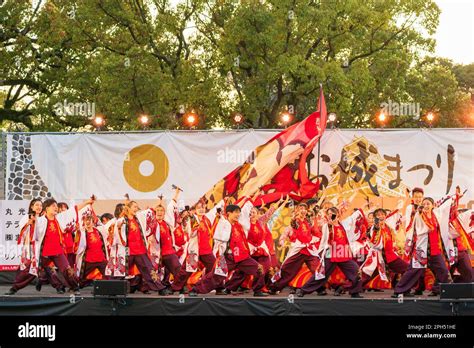 Mixed Sex Team Of Young Adult Japanese Dancers Wearing Red And White