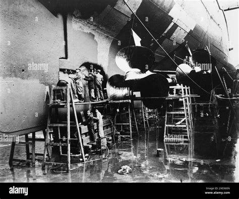Scenes On Board Hms Repulse During Her Refit 1940 In Dry Dock Workmen At Work On The Rudder