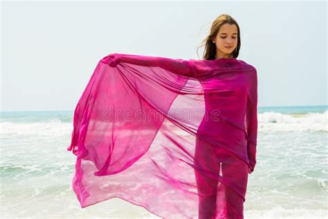 Sport Girl Teenager In A Pink Bathing Suit On Background Of Ocean