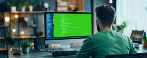 Software Developer Typing Code On A Computer In A Sleek Environment