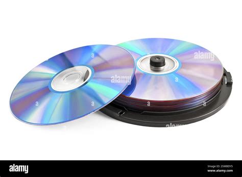 a stack of computer disks in a box and a separate drive near isolated